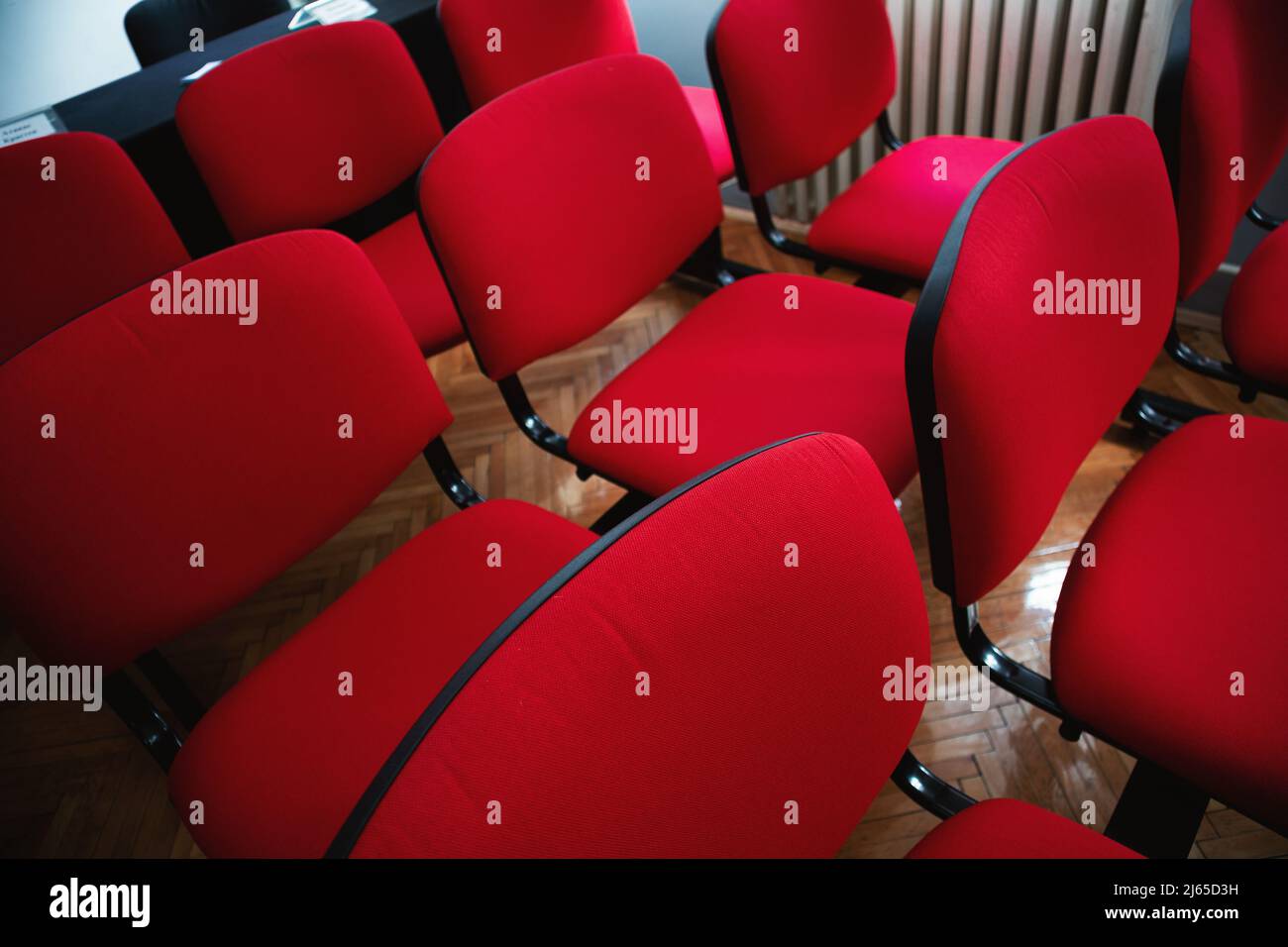 Interior of a classroom with red chairs Stock Photo - Alamy