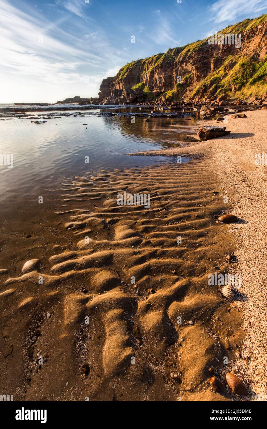 patterns in sand at the beach with clouds in sky Stock Photo - Alamy