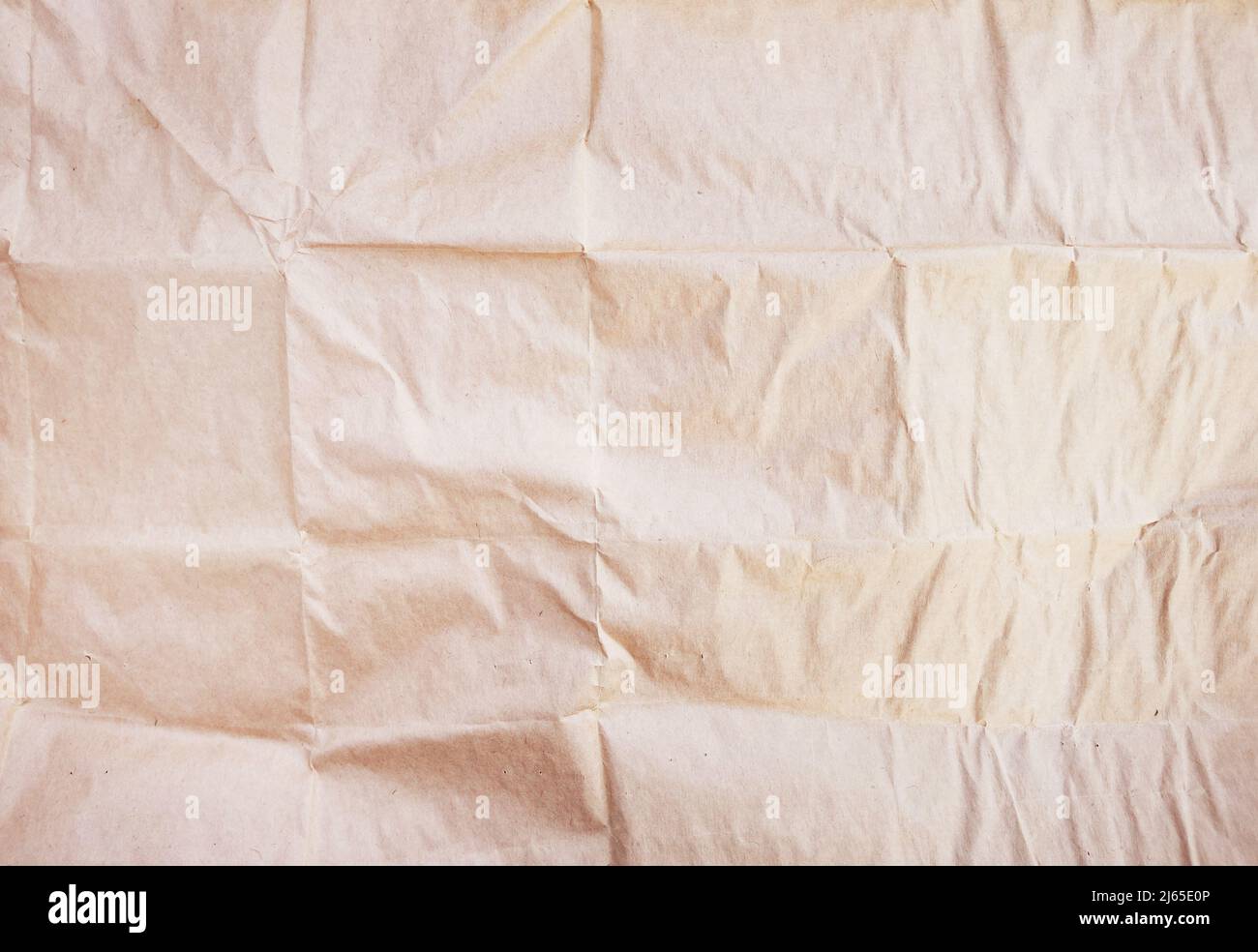 Brown wrinkled paper as a background Stock Photo - Alamy
