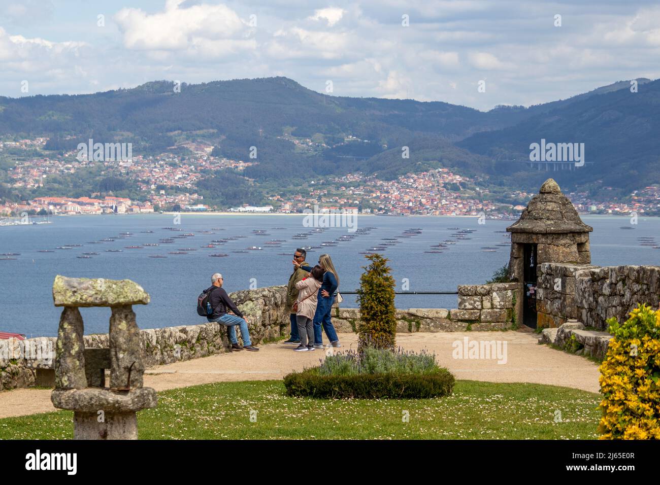 Vigo, Spain - Apr 25, 2020: People wathing the Vigo bay from the ...