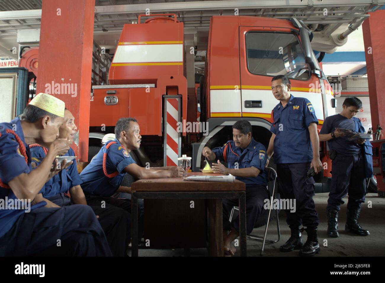 Firefighters having a relax time at their station in Petojo, Central ...