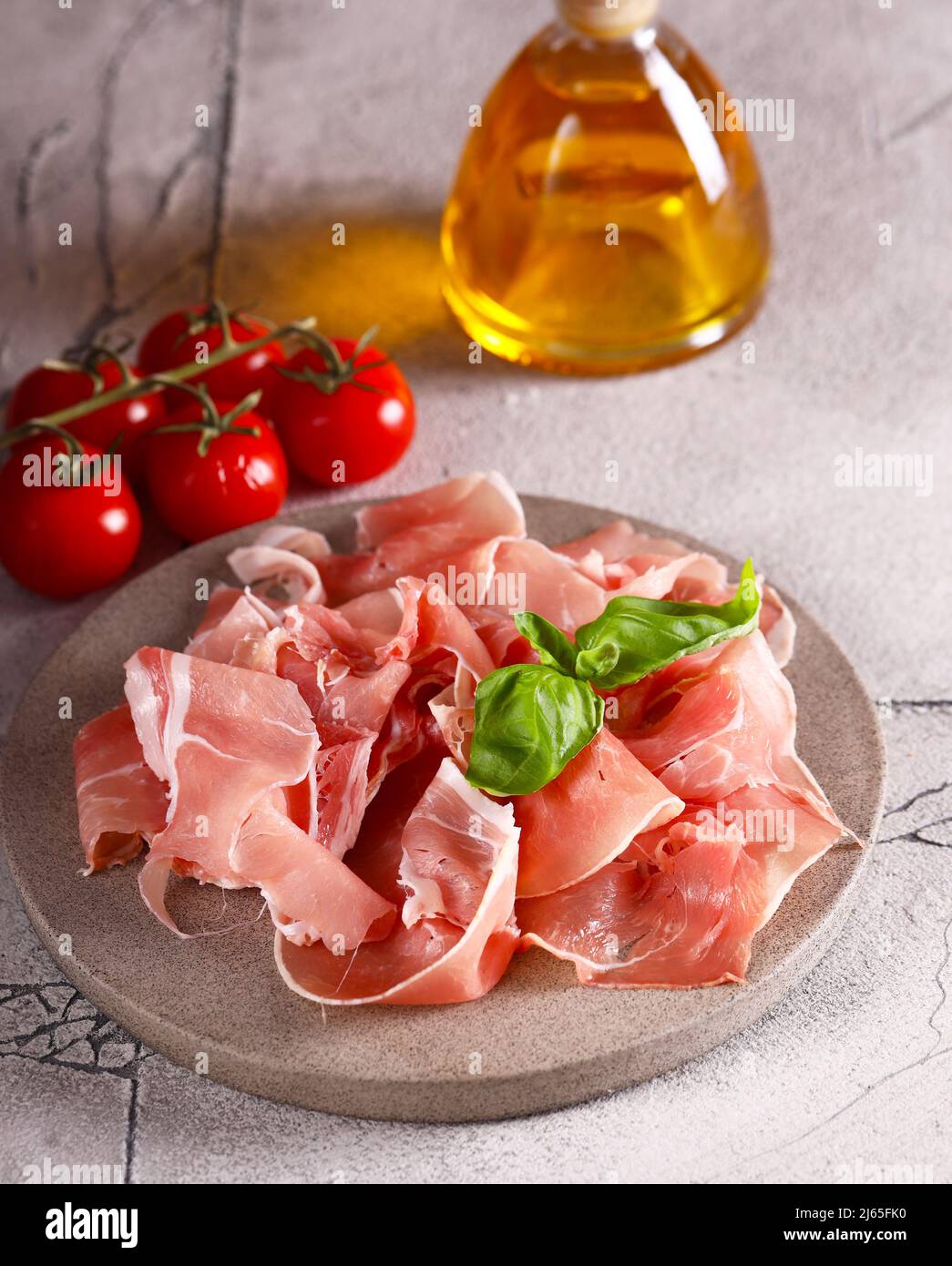 ham prosciutto jamon on a plate appetizer antipasto Stock Photo - Alamy