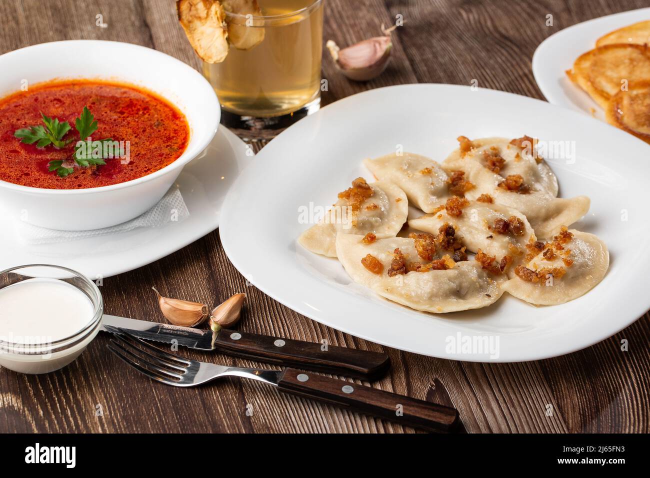 Traditional ukrainian dish vareniki and borscht served with greaves and ...