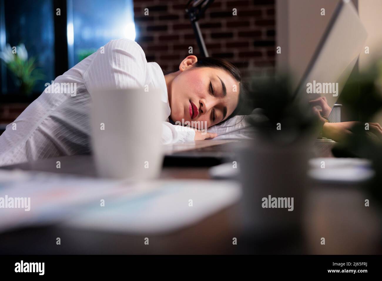 Exhausted executive manager with burnout syndrome resting at work ...