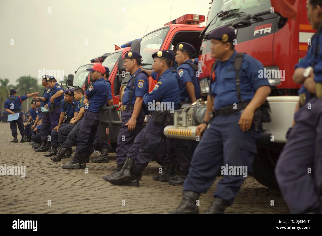 Members of the Jakarta's firefighting squad waiting to perform during a ...