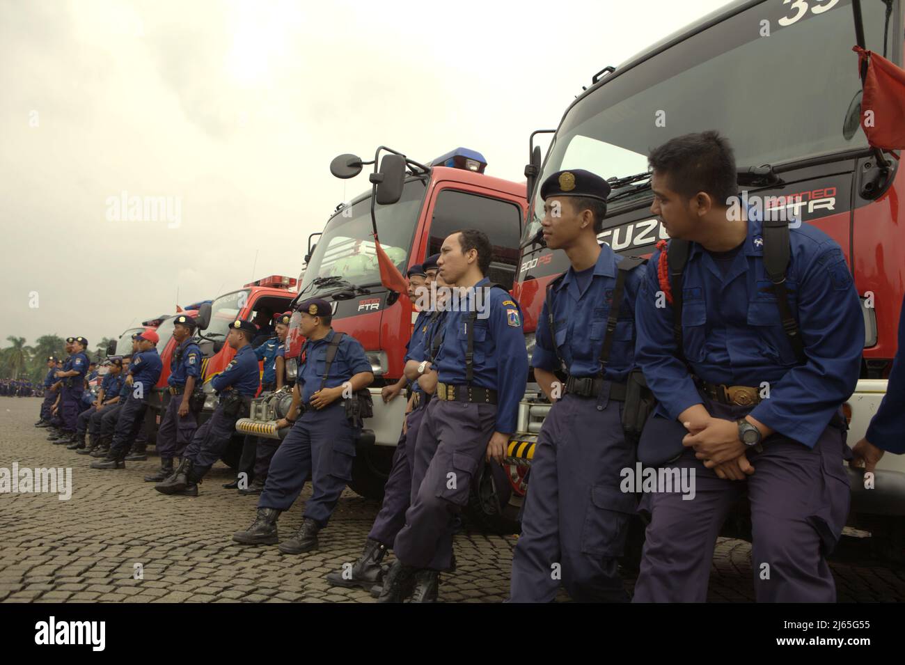 Members of the Jakarta's firefighting squad waiting to perform during a ...