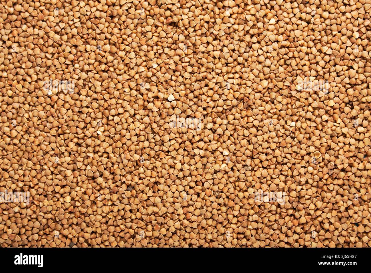 Raw buckwheat background. Close up image of buckwheat Stock Photo - Alamy