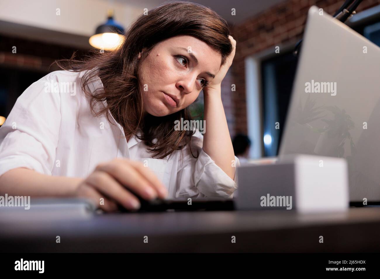 Tired business company employee sitting at desk in office workspace ...