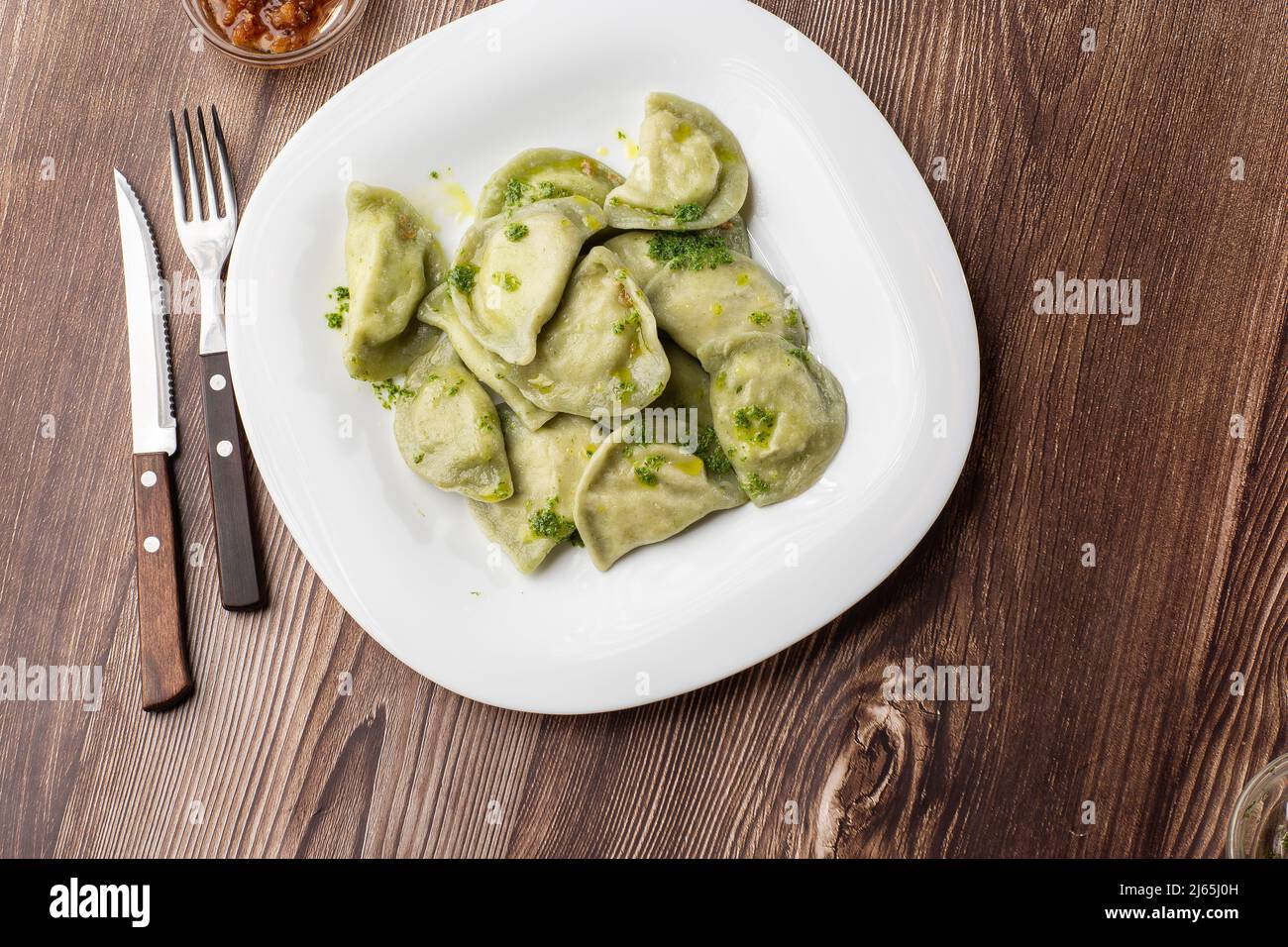 Traditional ukrainian dish vareniki served in a bowl with greaves and ...