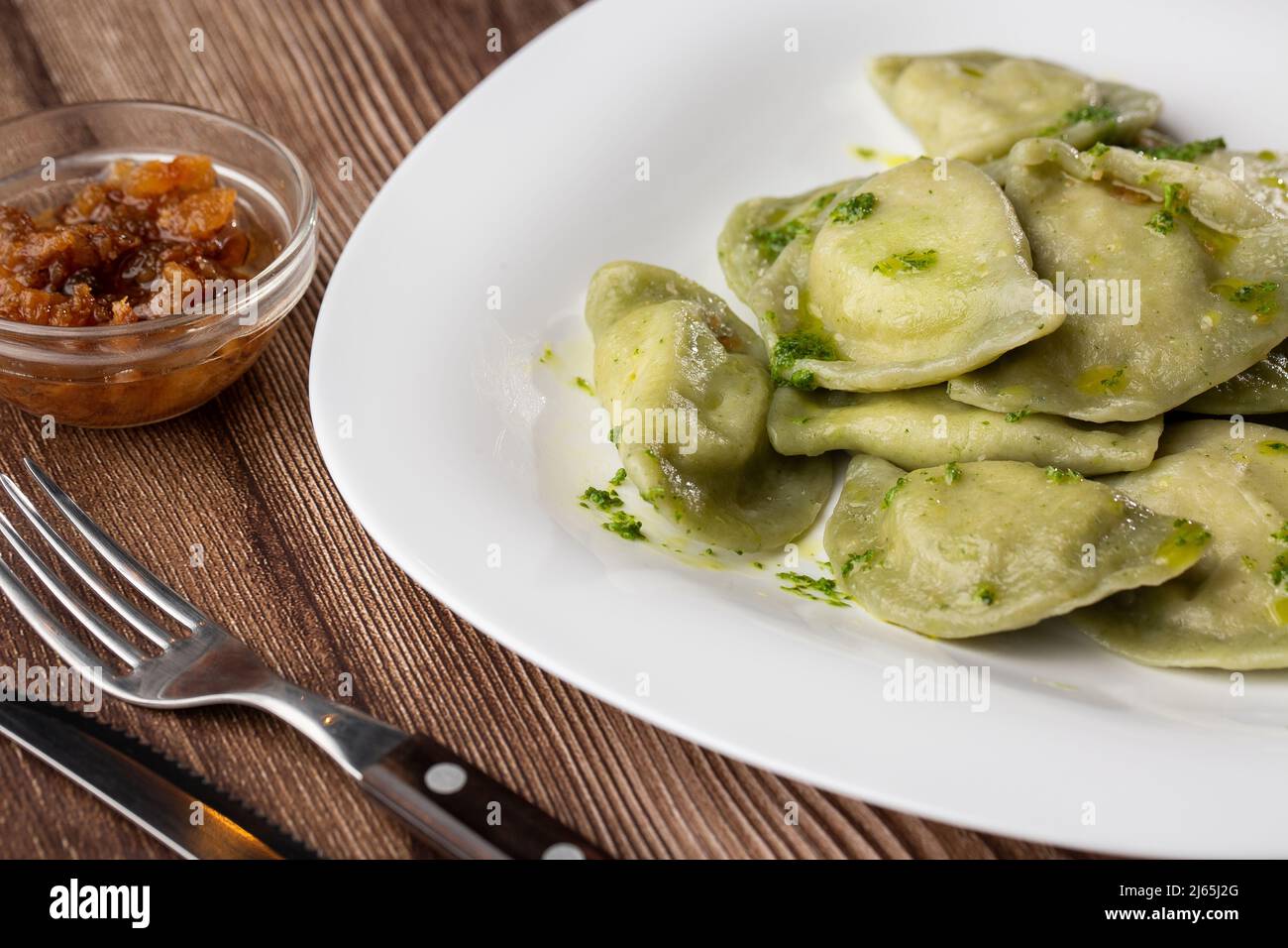 Traditional ukrainian dish vareniki served in a bowl with greaves and ...