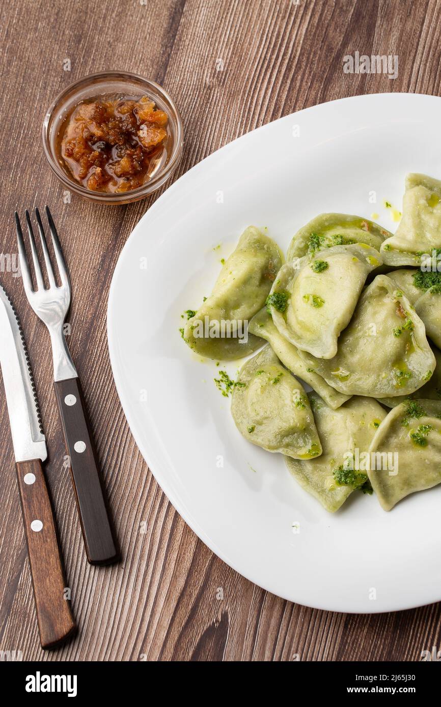 Traditional ukrainian dish vareniki served in a bowl with greaves and ...