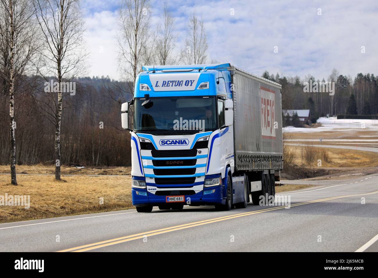 Scania S450 truck of L Retva Oy pulls Freja semi trailer along Highway ...
