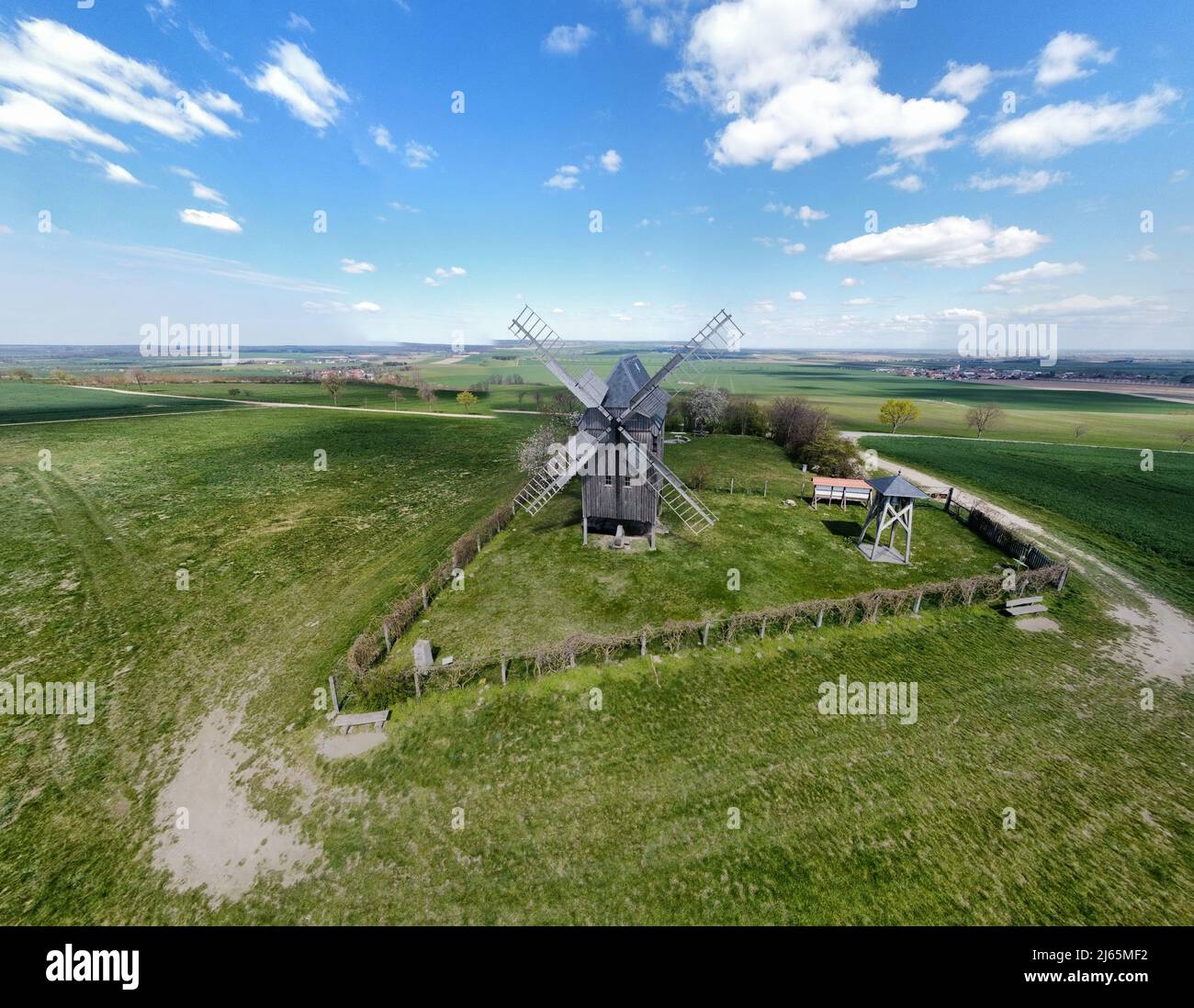 A drone flight of a historic wooden windmill in a panoramic view Stock ...