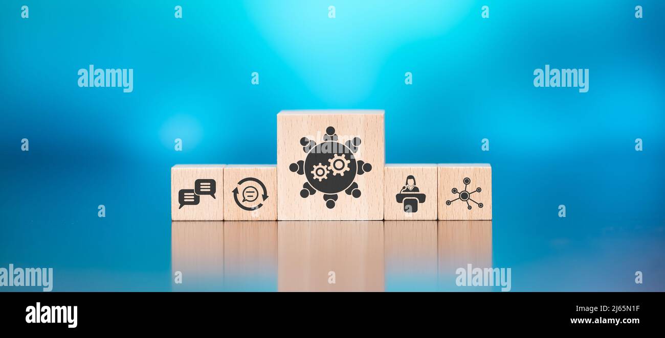 Wooden blocks with symbol of workshop concept on blue background Stock ...