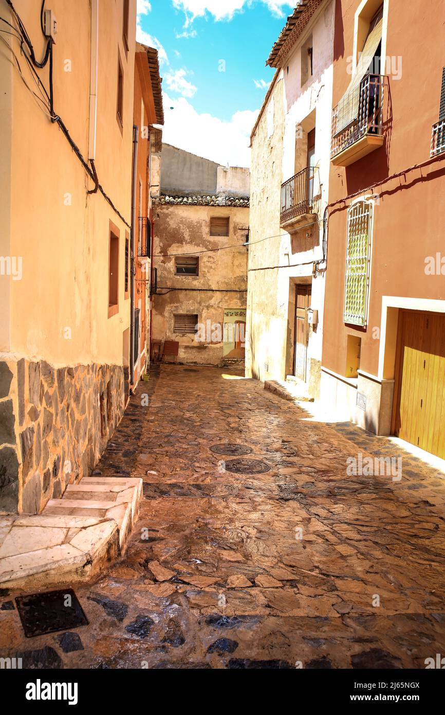 Finestrat, Alicante, Spain- April 23, 2022: Narrow cobbled street and ...