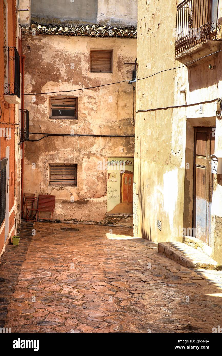 Finestrat, Alicante, Spain- April 23, 2022: Narrow cobbled street and ...