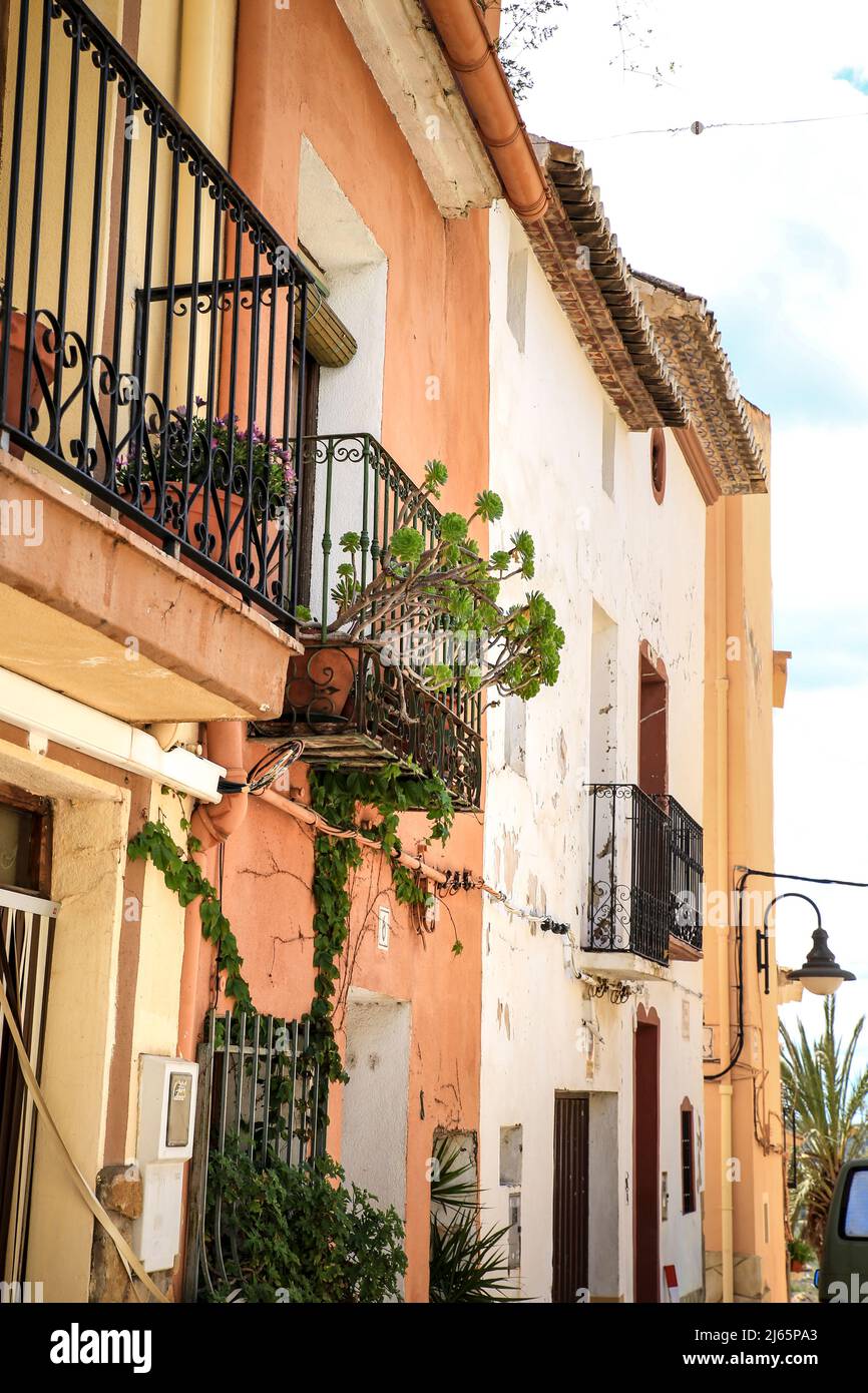 Finestrat, Alicante, Spain- April 23, 2022: Narrow cobbled street and ...