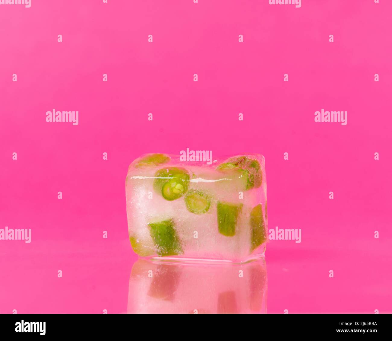 Green Beans Frozen in an Ice Cube Stock Photo - Alamy