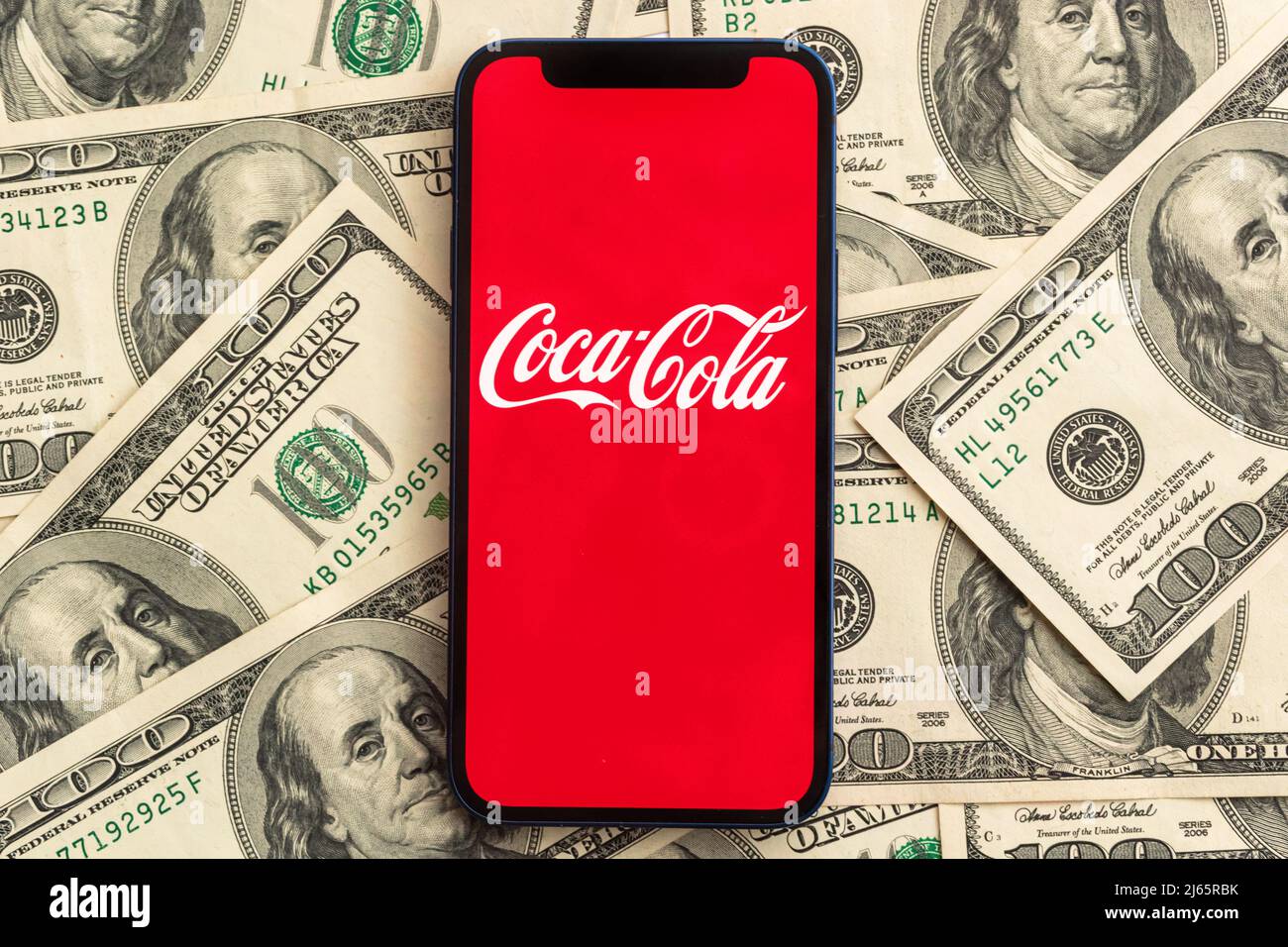 Coca-cola stock market price. Logo close-up view and dollar money ...