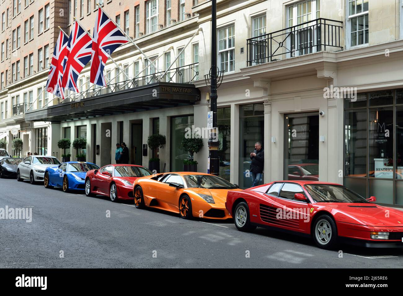 Sports cars outside the May Fair Hotel, Stratton Street, Mayfair, West London, United Kingdom ...