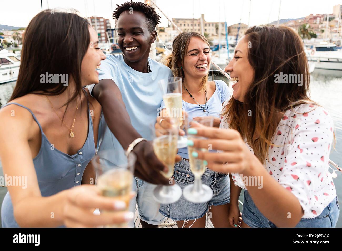 Group of multiracial friends having fun celebrating birthday on summer ...