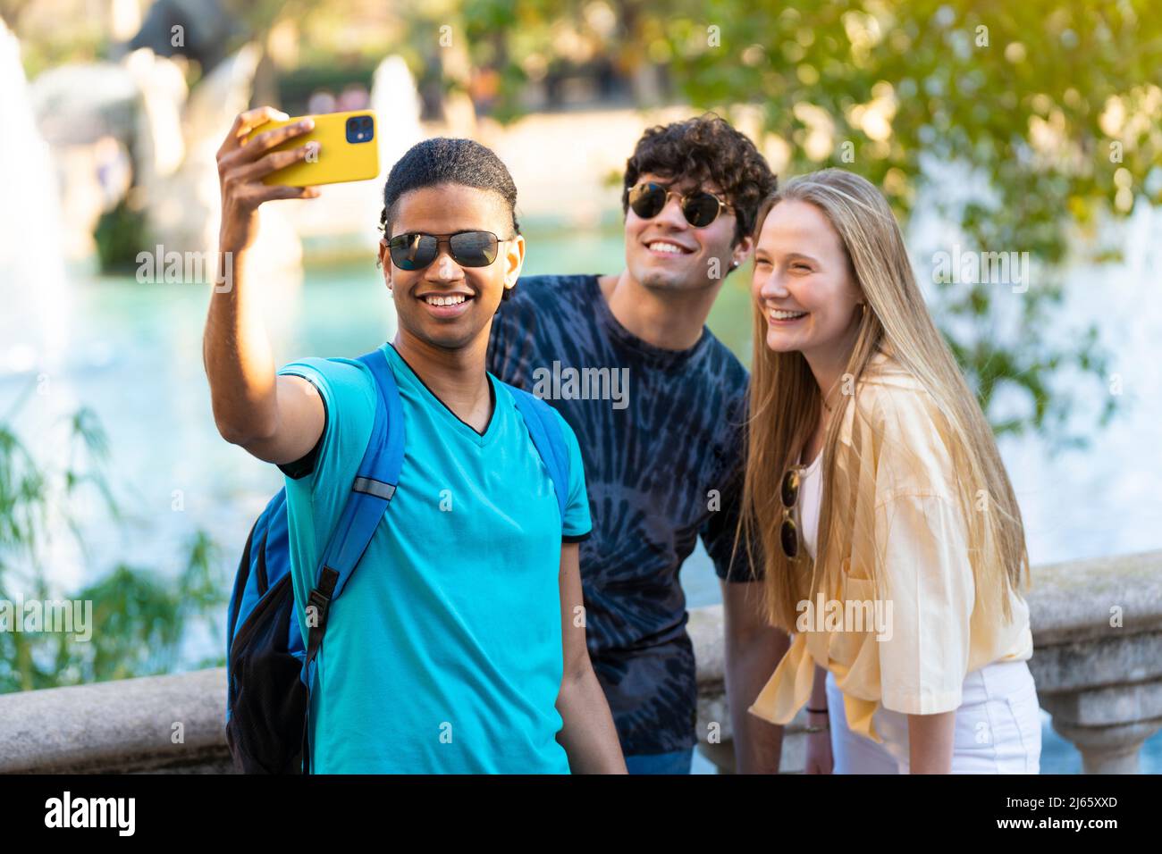 Group of young friends taking a selfie on vacation visiting a landmark ...