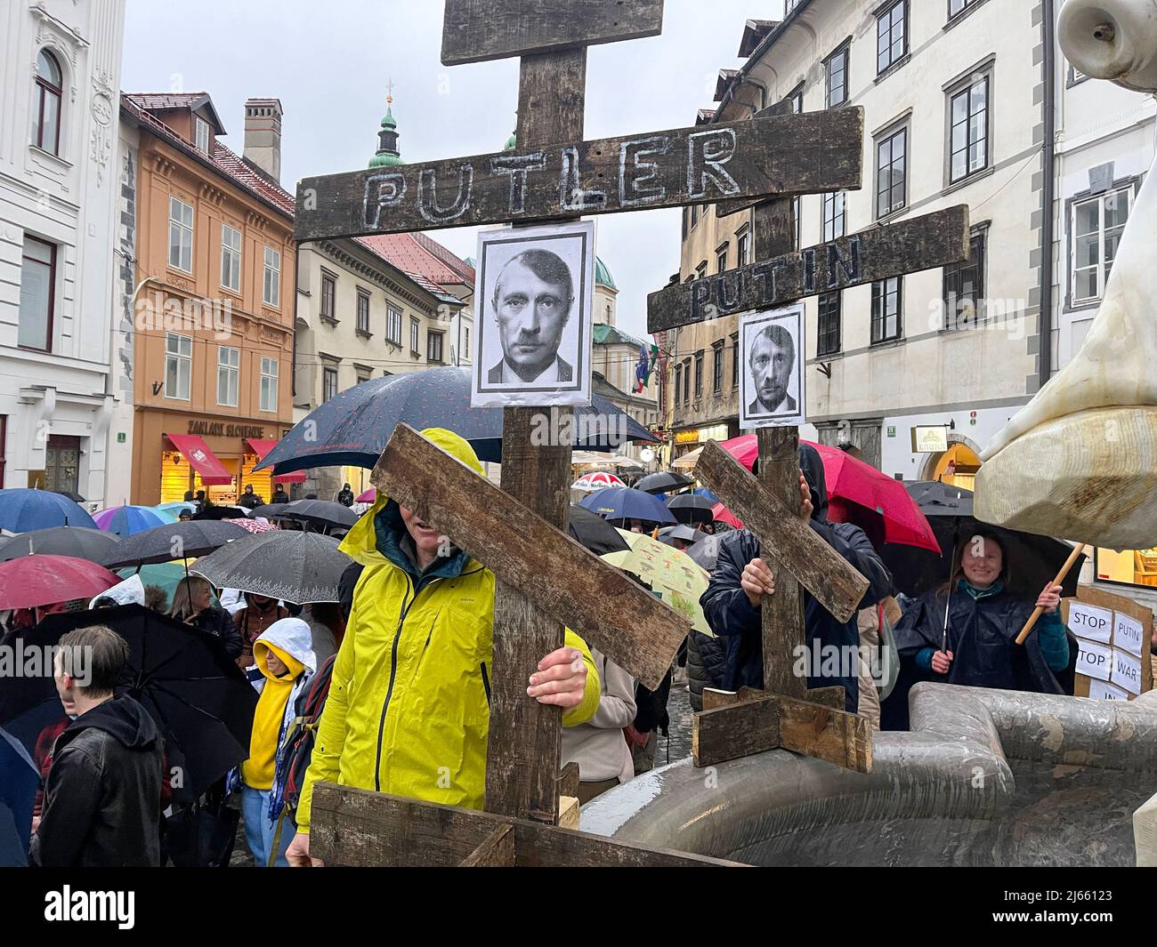 People with Putin's posters on cross of crucifixion and inscription ...