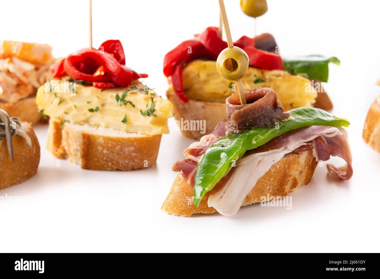 Assortment of Spanish pintxos isolated on white background Stock Photo ...