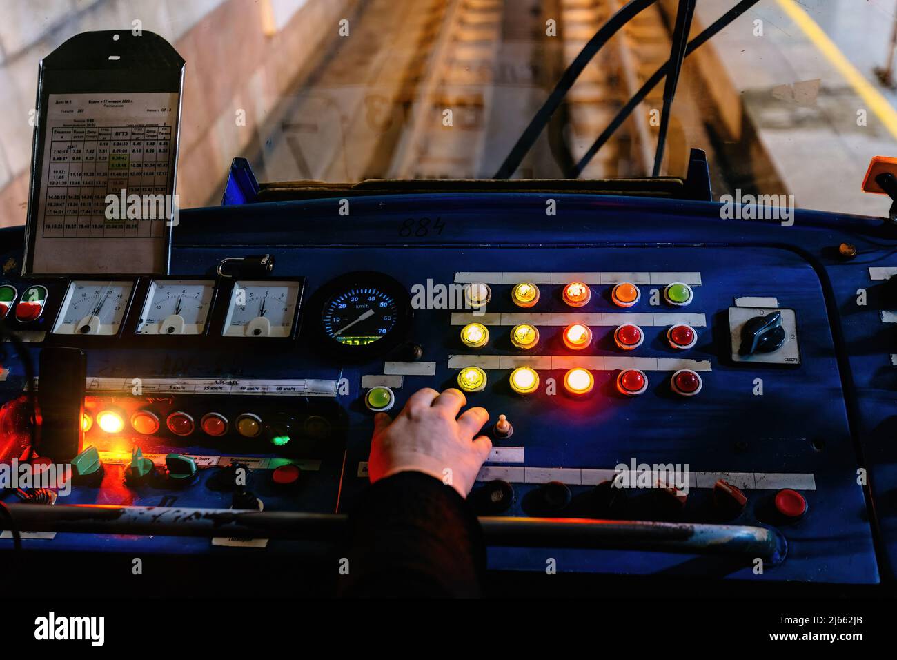 Hand of subway train driver on the dashboard Stock Photo - Alamy