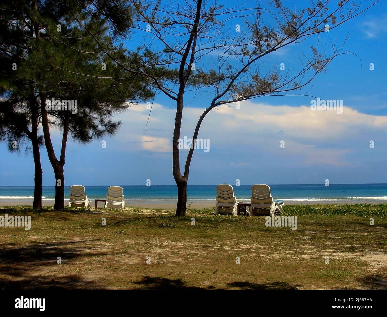 Tropical beach location with sun loungers in Sabah Malaysian Borneo ...