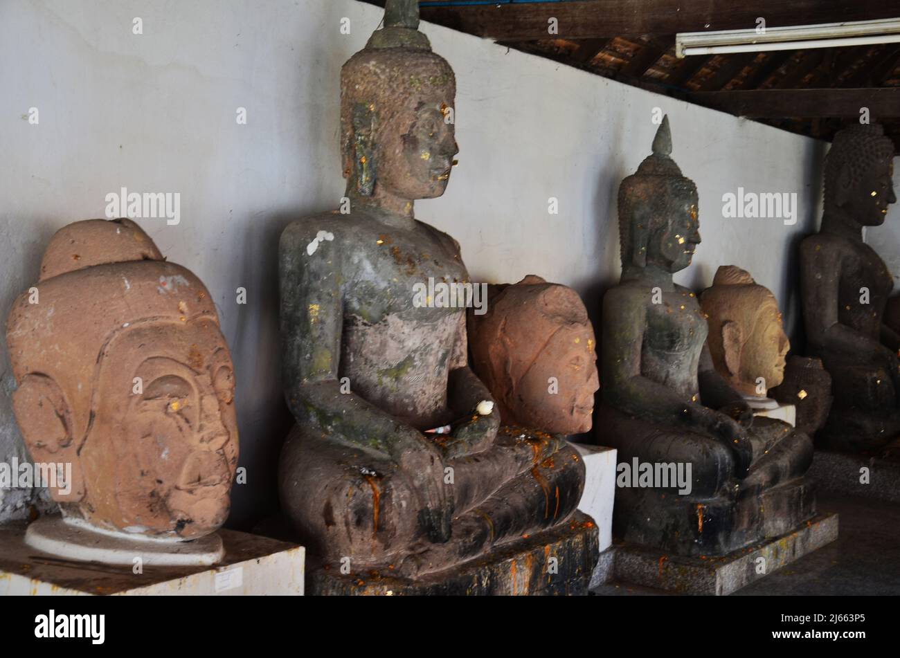 Ancient ruins buddha statue in antique building ubosot for thai people ...
