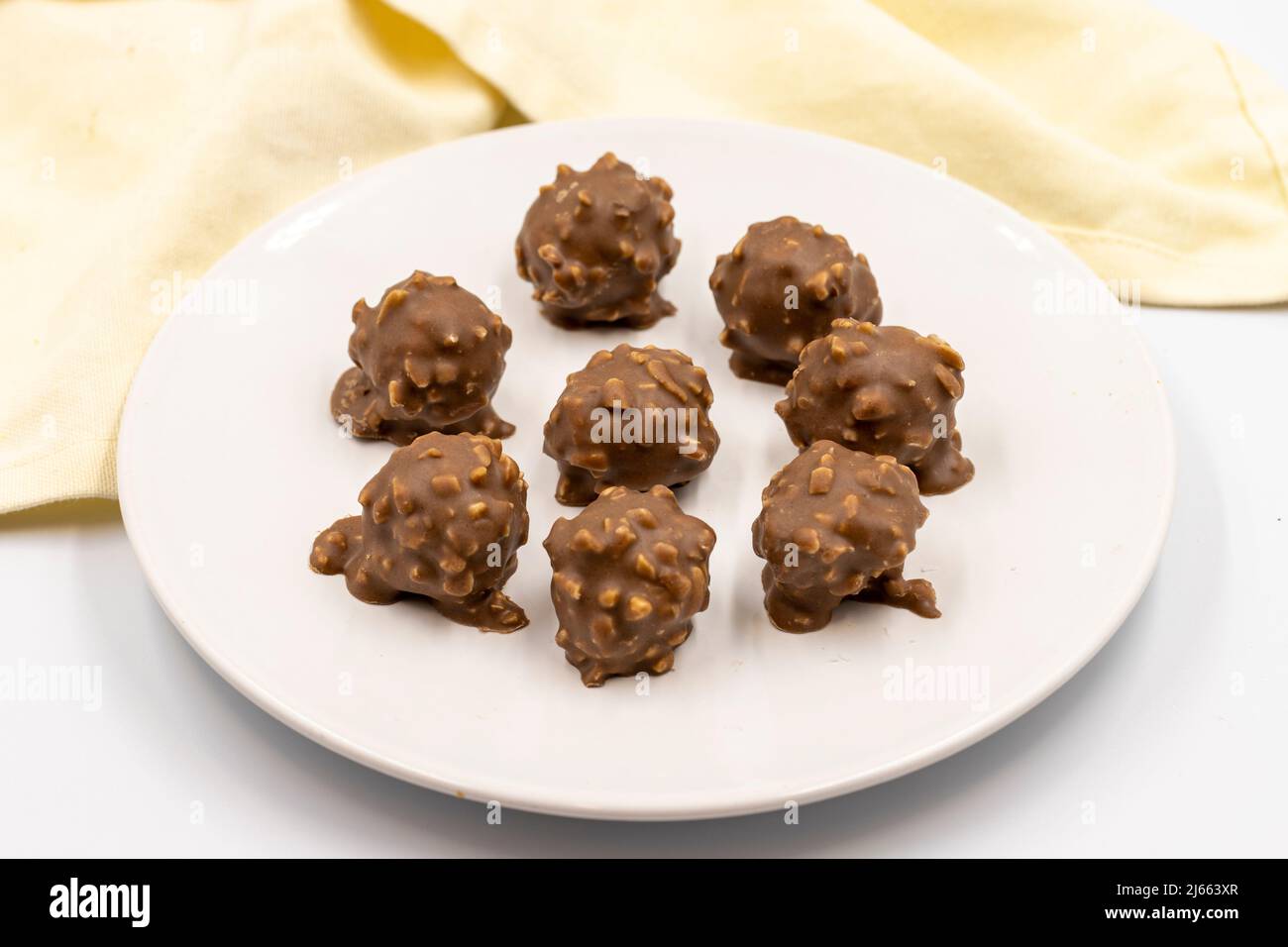 Chocolate with Hazelnut Chips. Special chocolates on a white background ...