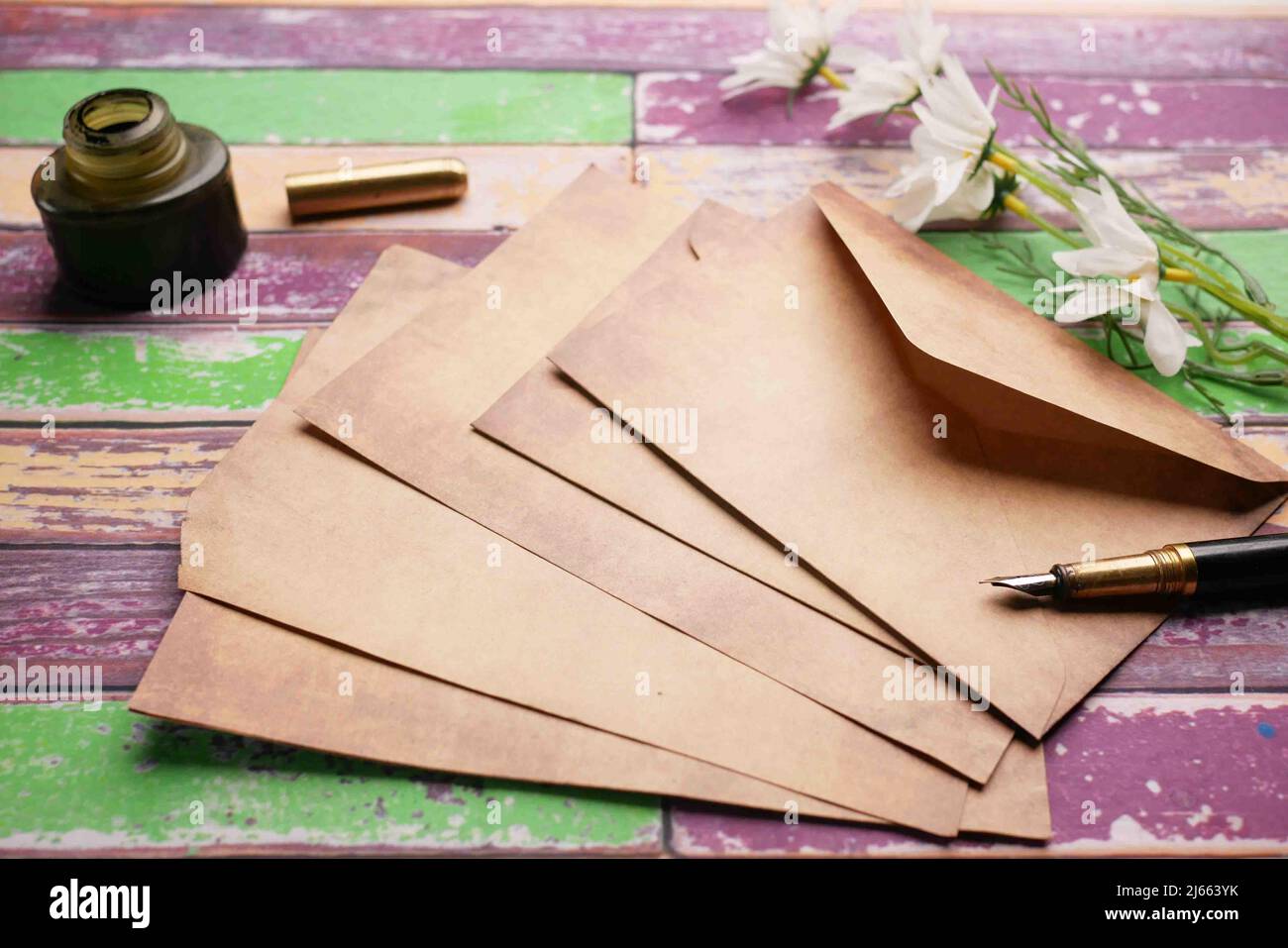 envelope , empty paper and fountain pen on table Stock Photo - Alamy