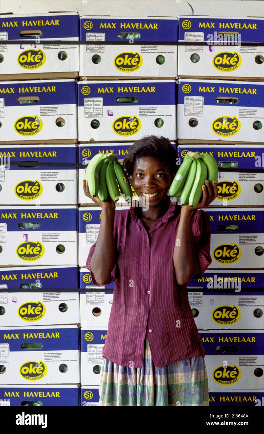 Ghana, New Akrade; woman showing bananas Stock Photo - Alamy