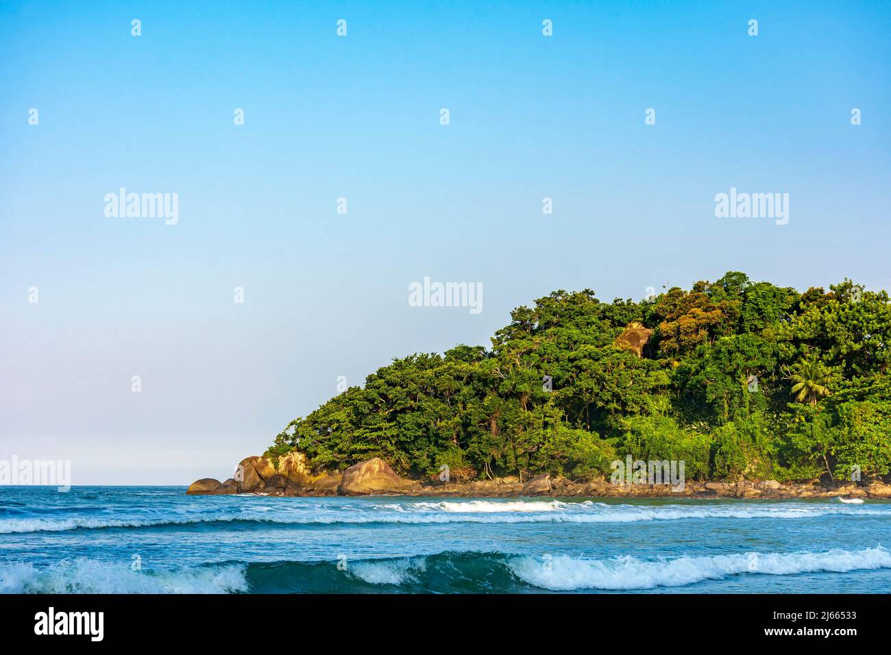 Peaceful and idyllic beach with the rainforest and the sea in Bertioga ...