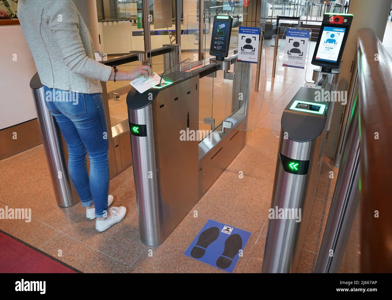 Hamburg, Germany. 28th Apr, 2022. A woman scans her boarding pass next ...