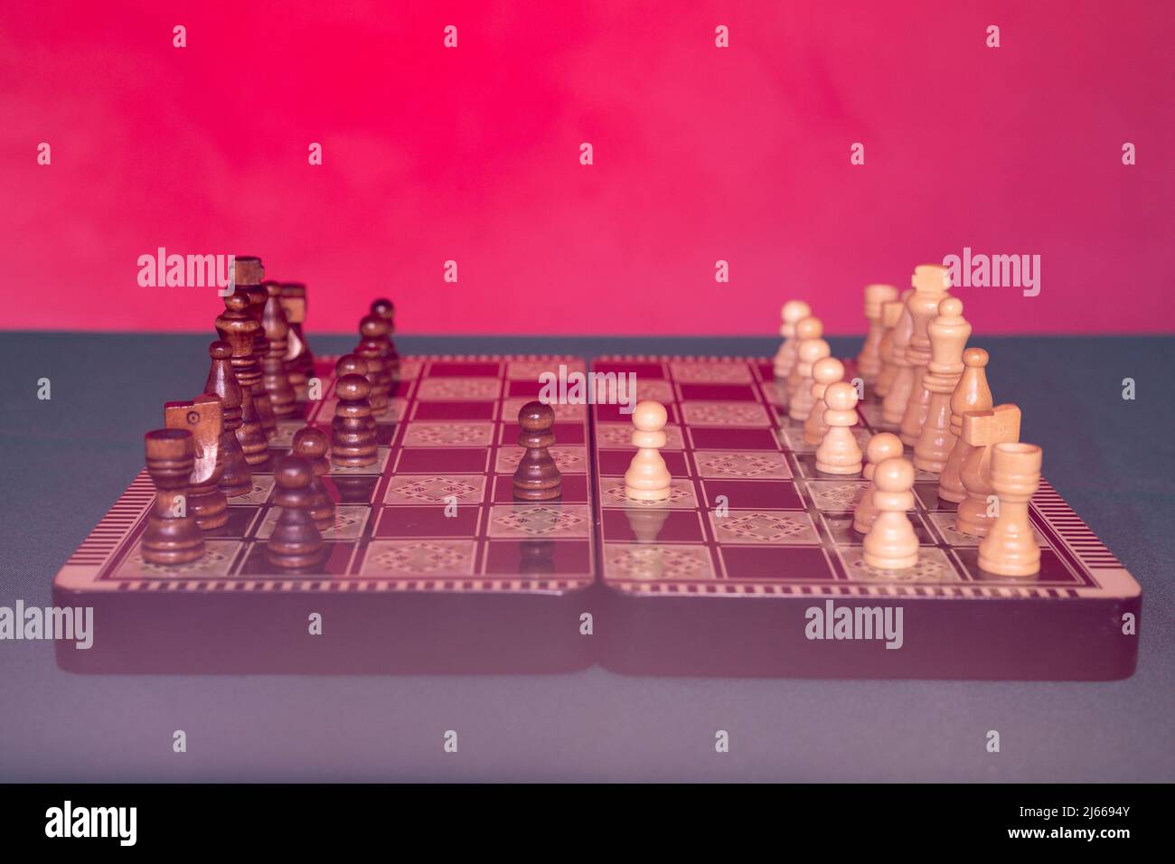 Two pawns met on a chess board Stock Photo - Alamy