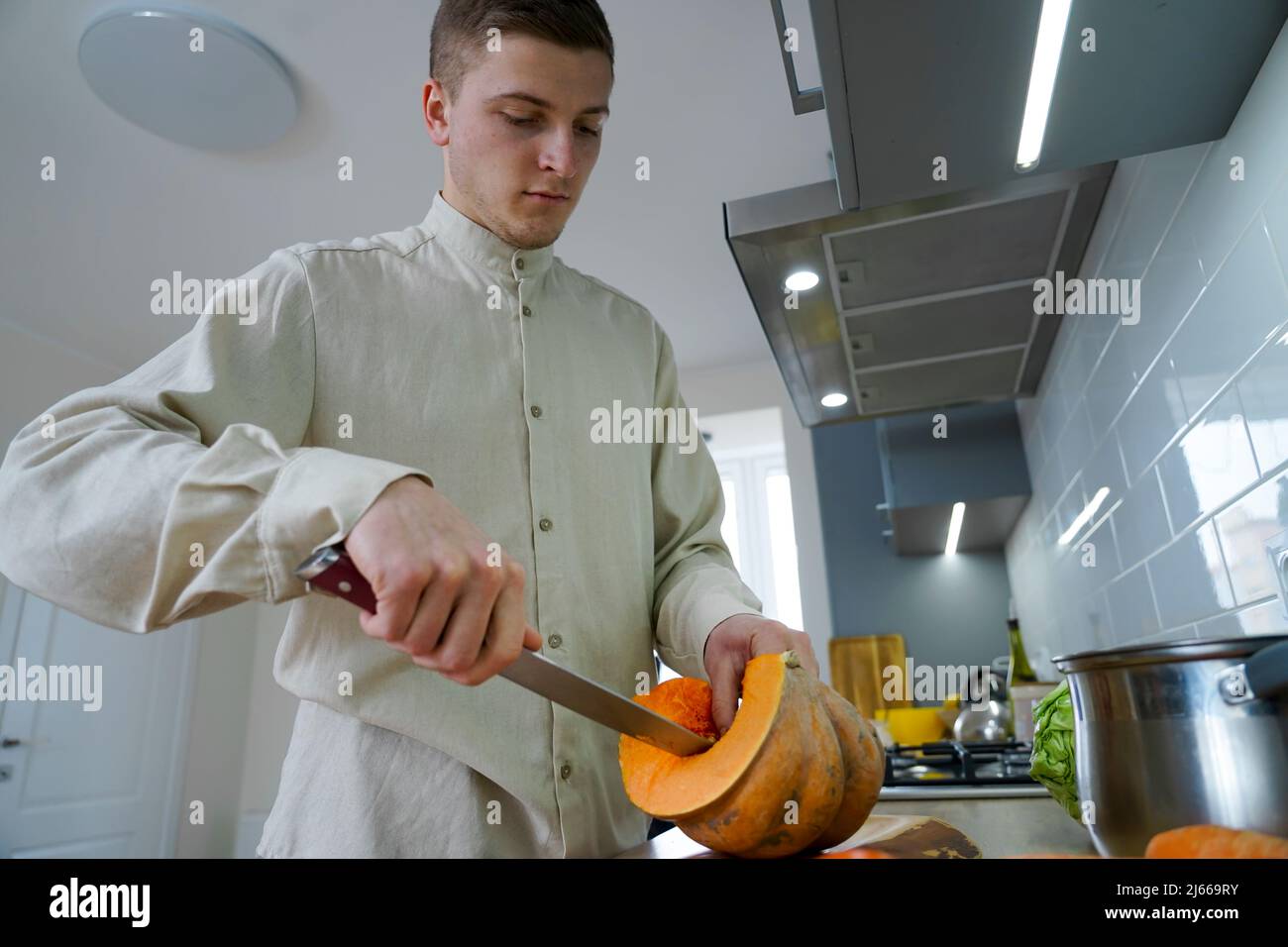 Professional chef prepares white fish hi-res stock photography and ...