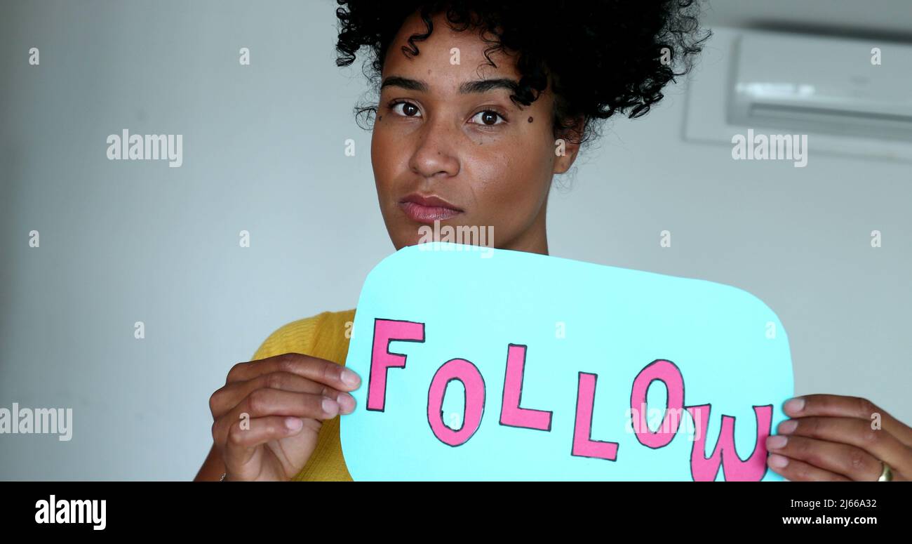 Female vlogger asking audience to follow on social media Stock Photo ...