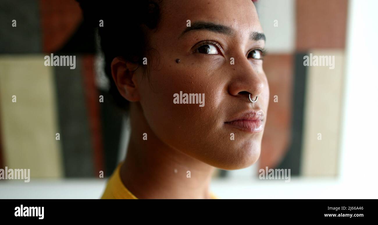 Mixed race young black woman face portrait looking at camera Stock ...