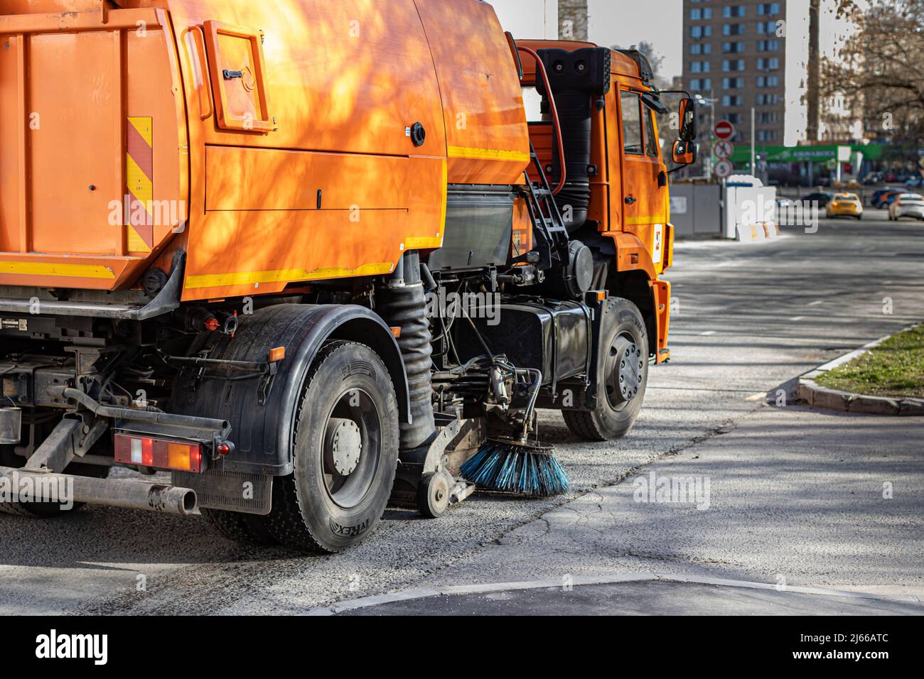 Moscow, Russia - April 20, 2022: a special machine cleans the curb and ...