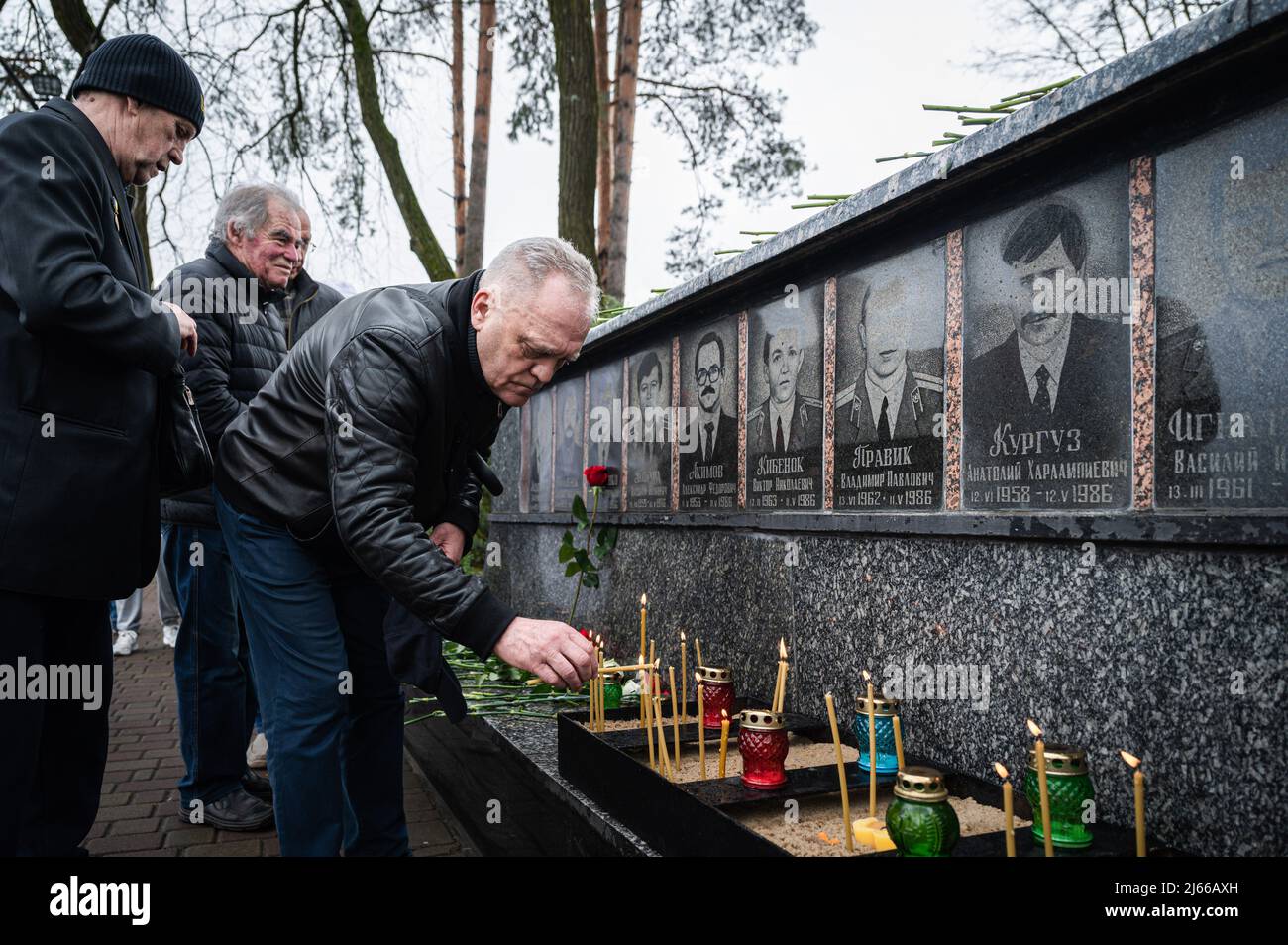A performer seen holding ceremonial candles during the 36th anniversary ...