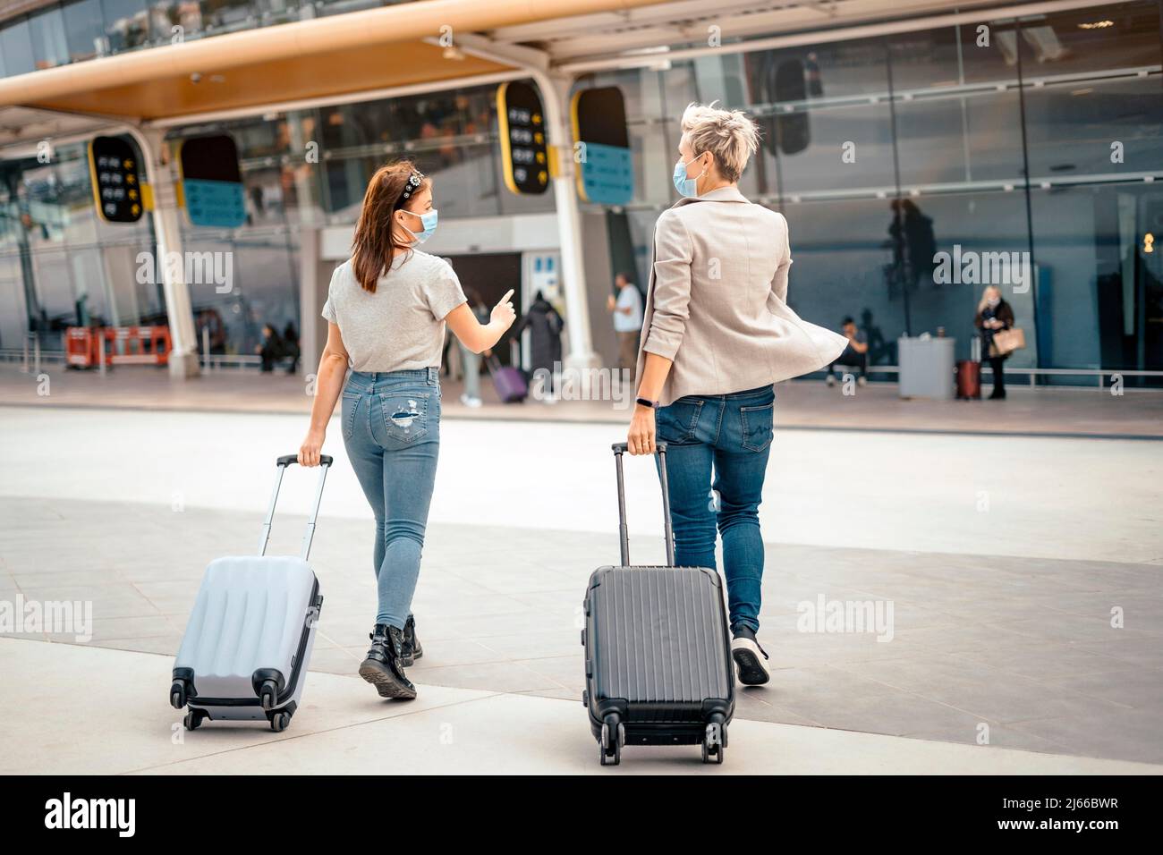 Woman approaching friends hi-res stock photography and images - Alamy