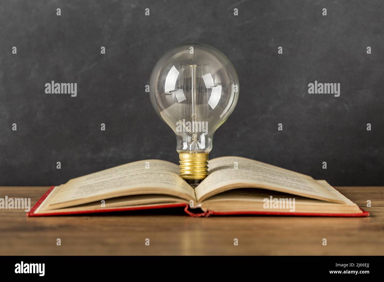 Arrangement with book and light bulb, concept Idea, Learning, Reading ...