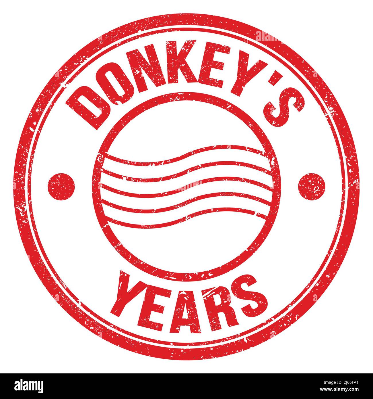 DONKEY'S YEARS text written on red round postal stamp sign Stock Photo ...