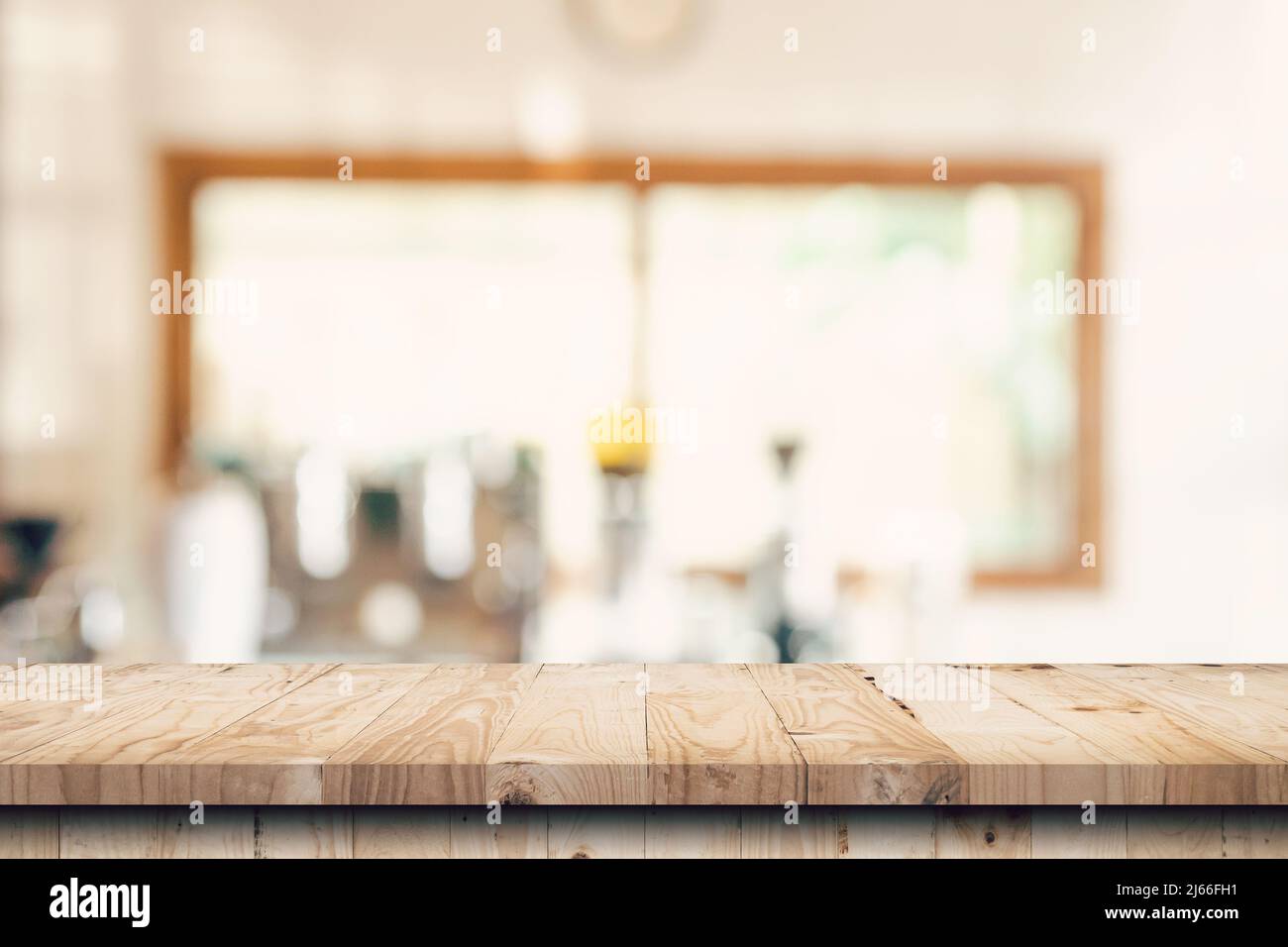 Wooden table top with blurred people in coffee shop and cafe background ...