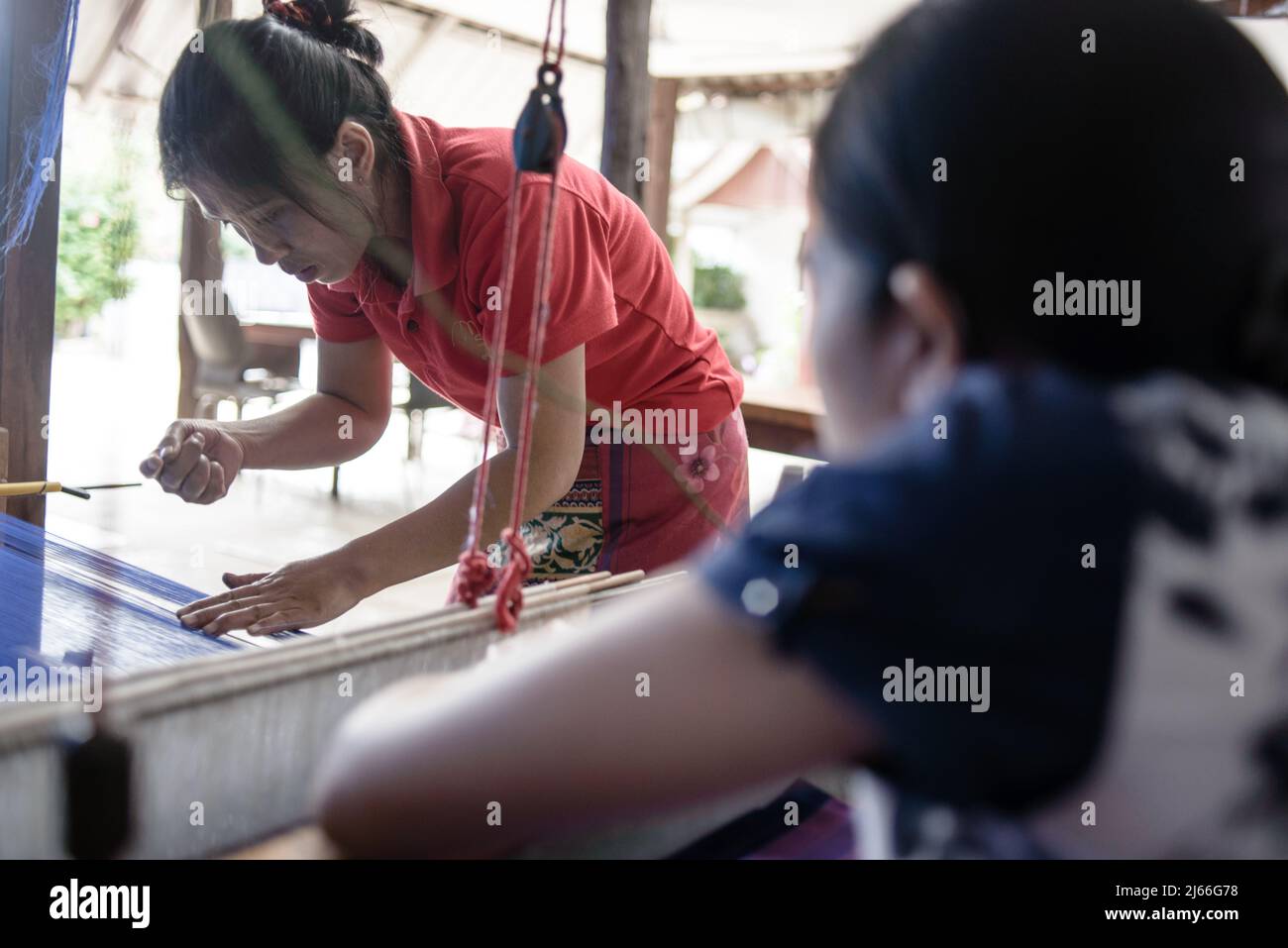 Silk weaving process at the Mai Savanh Lao workshop in Vientiane, Laos ...