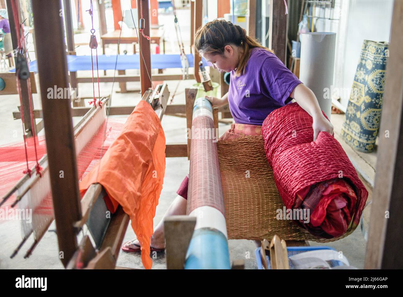 Silk weaving process at the Mai Savanh Lao workshop in Vientiane, Laos ...