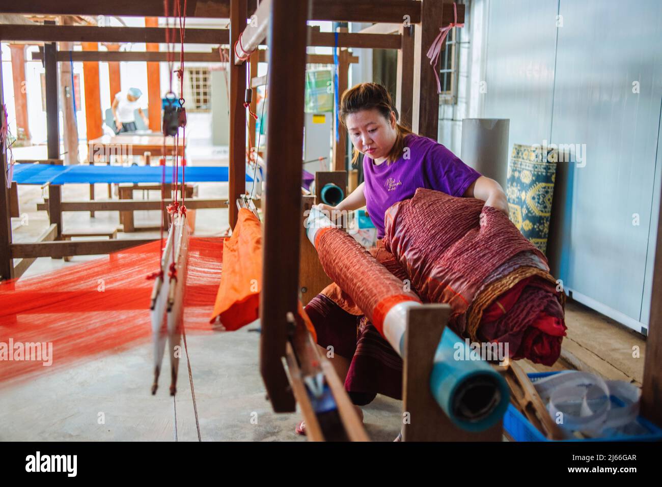 Silk weaving process at the Mai Savanh Lao workshop in Vientiane, Laos ...