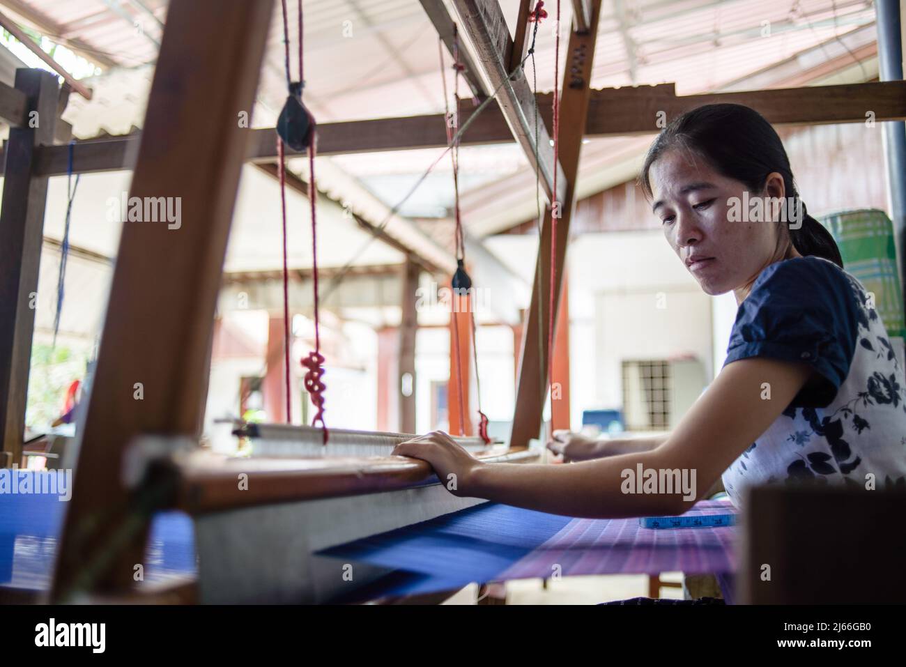 Silk weaving process at the Mai Savanh Lao workshop in Vientiane, Laos ...